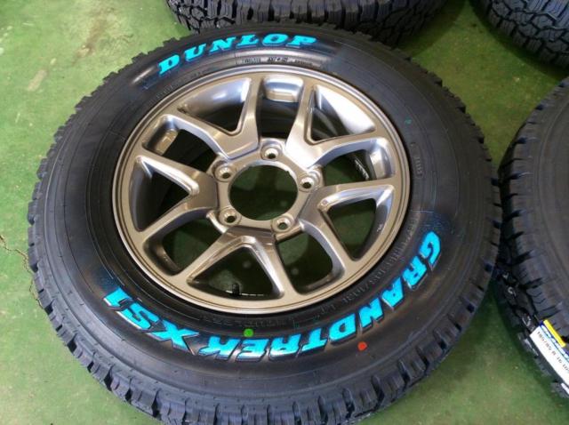99 スズキ JB64 ジムニー純正アルミ + DUNLOP(ダンロップ) GRANDTREK XS1 185/85R16 ★タイヤは新品!ホワイトレターのスタッドレス!オールシーズン ...