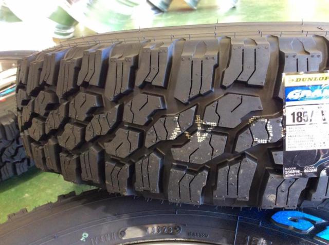 99 スズキ JB64 ジムニー純正アルミ + DUNLOP(ダンロップ) GRANDTREK XS1 185/85R16 ★タイヤは新品!ホワイトレターのスタッドレス!オールシーズン ...